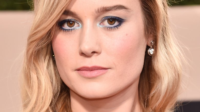 Captain Marvel takes down a bad guy in set video